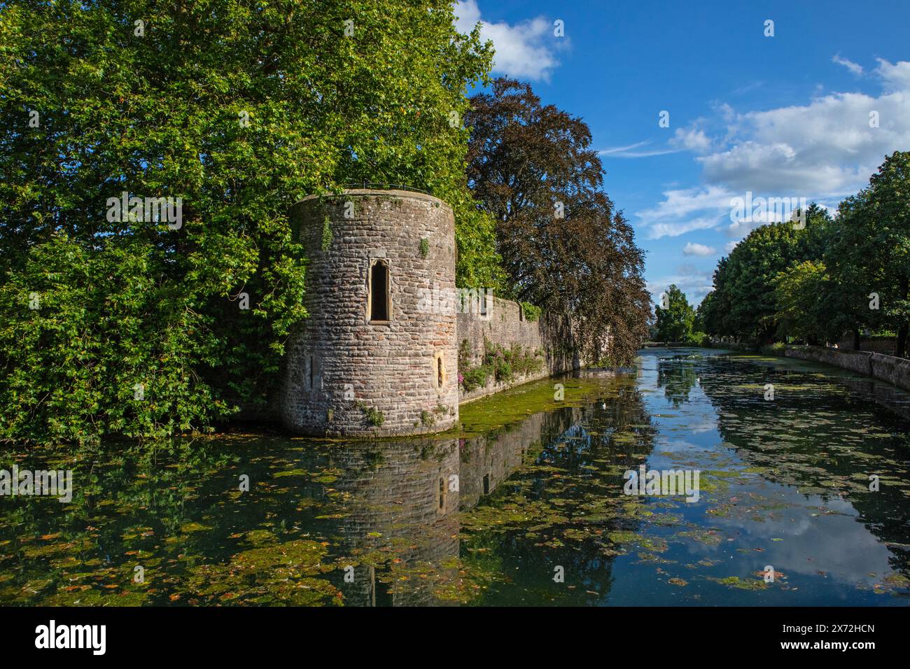 The boundary wall and moat of the historic Bishops Palace in the city ...