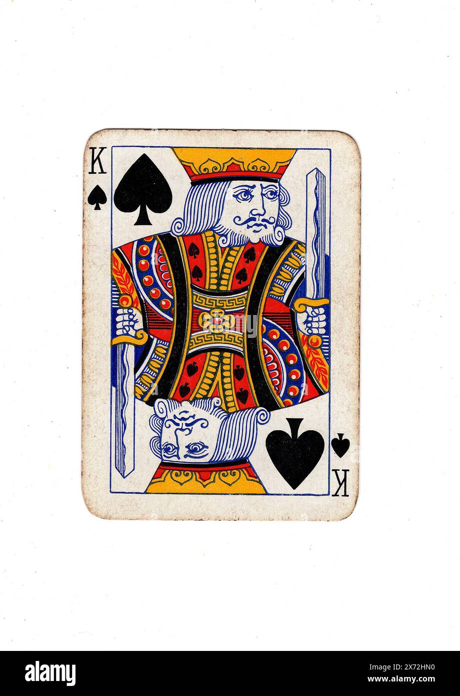 An antique king of spades playing card isolated on a white background ...