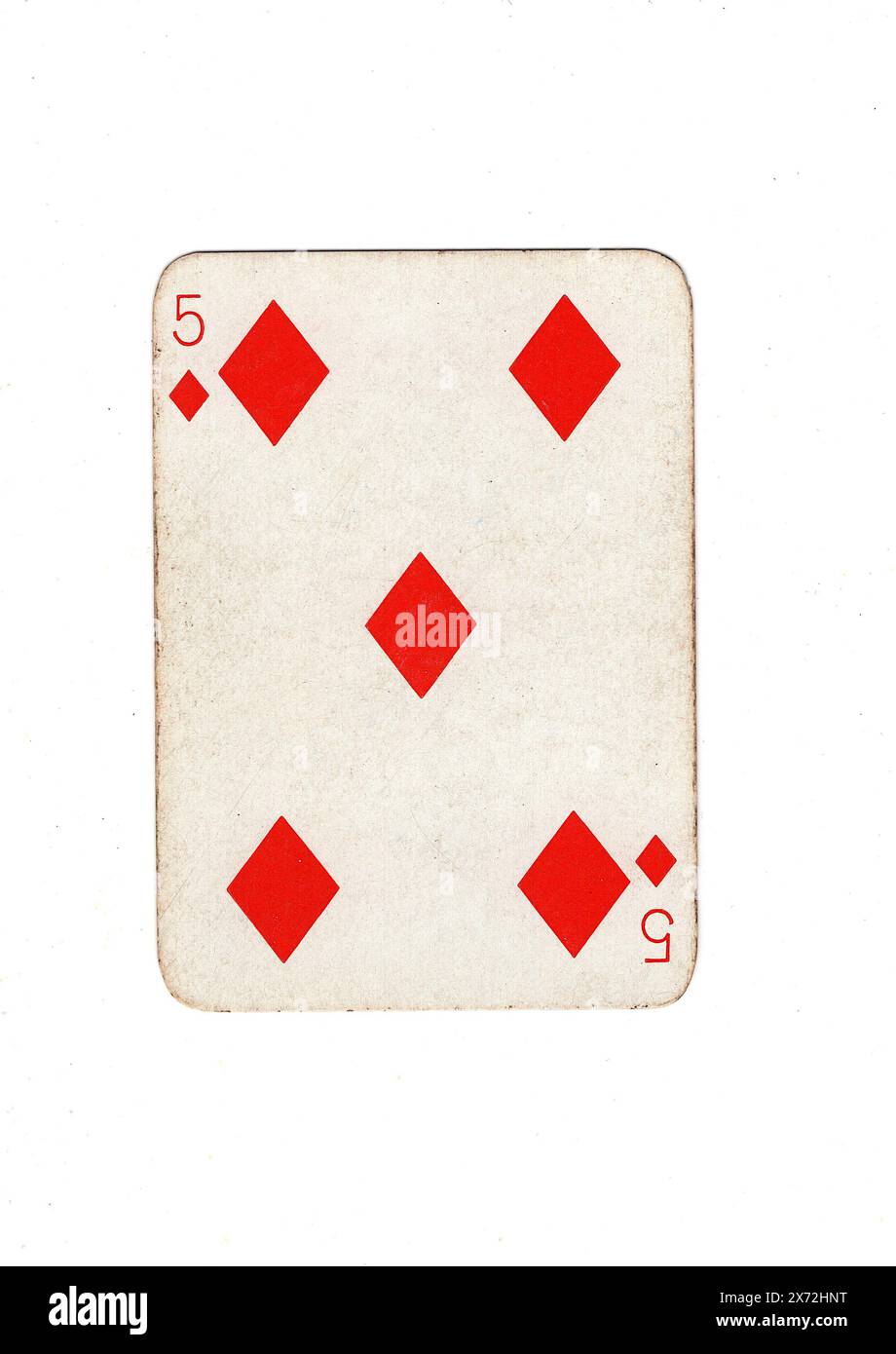 An antique five of diamonds playing card isolated on a white background ...