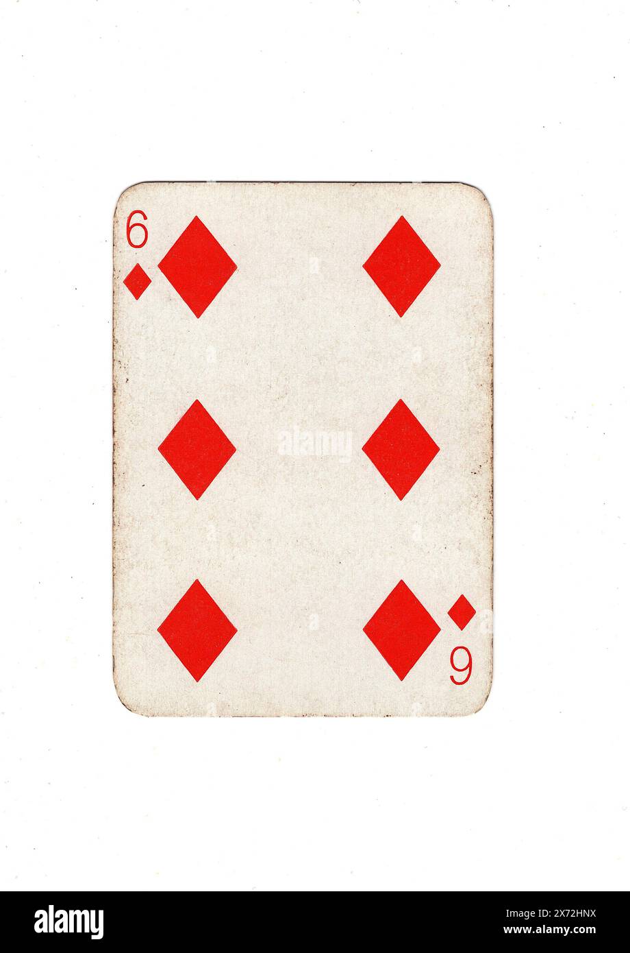 An antique six of diamonds playing card isolated on a white background ...