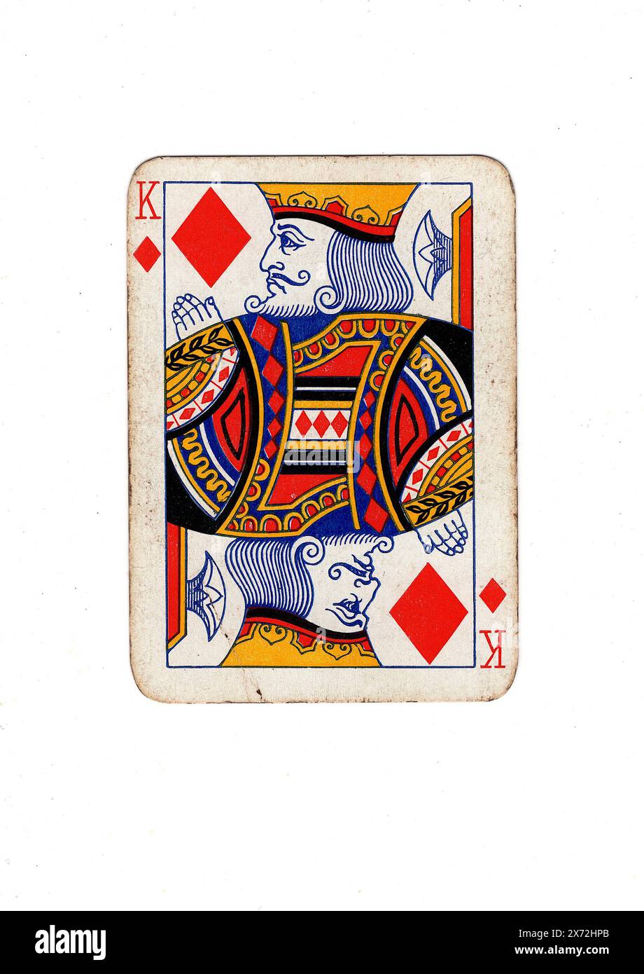 An antique king of diamonds playing card isolated on a white background ...