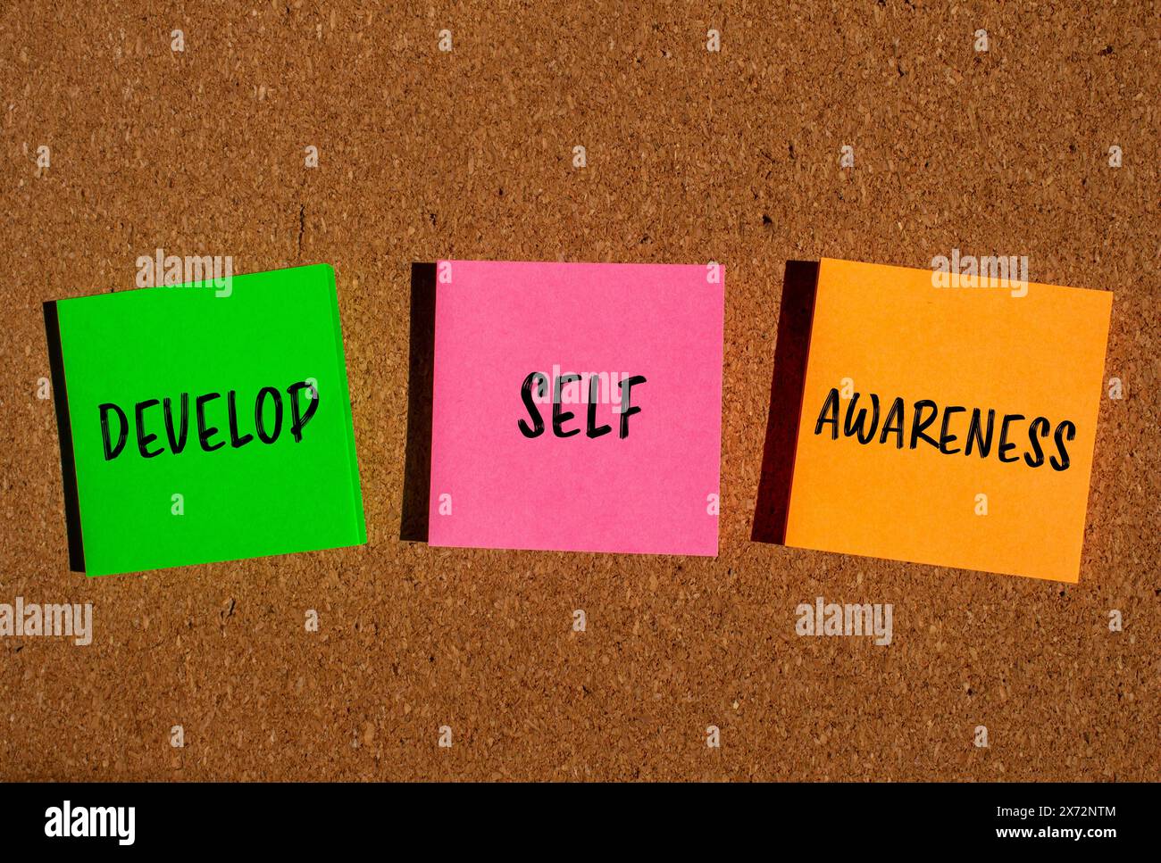 Develop self awareness words written on colorful papers with brown ...