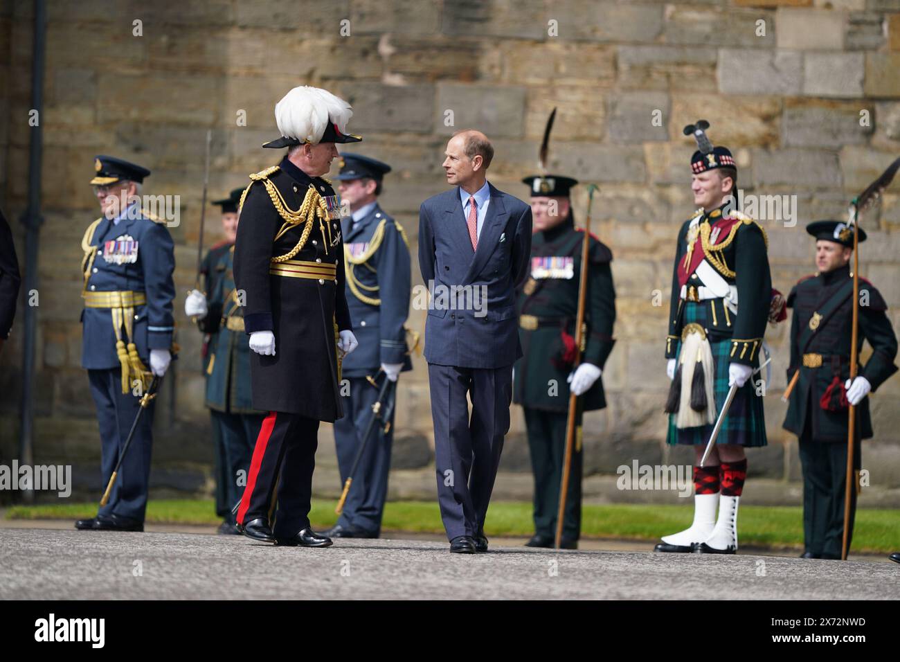 The Duke of Edinburgh walks with journalist and television ...