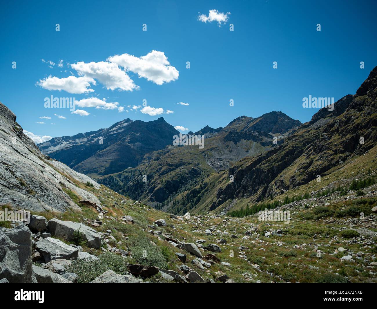 Green valley with grass and rocks, in the Lys valley, above Staffal and ...