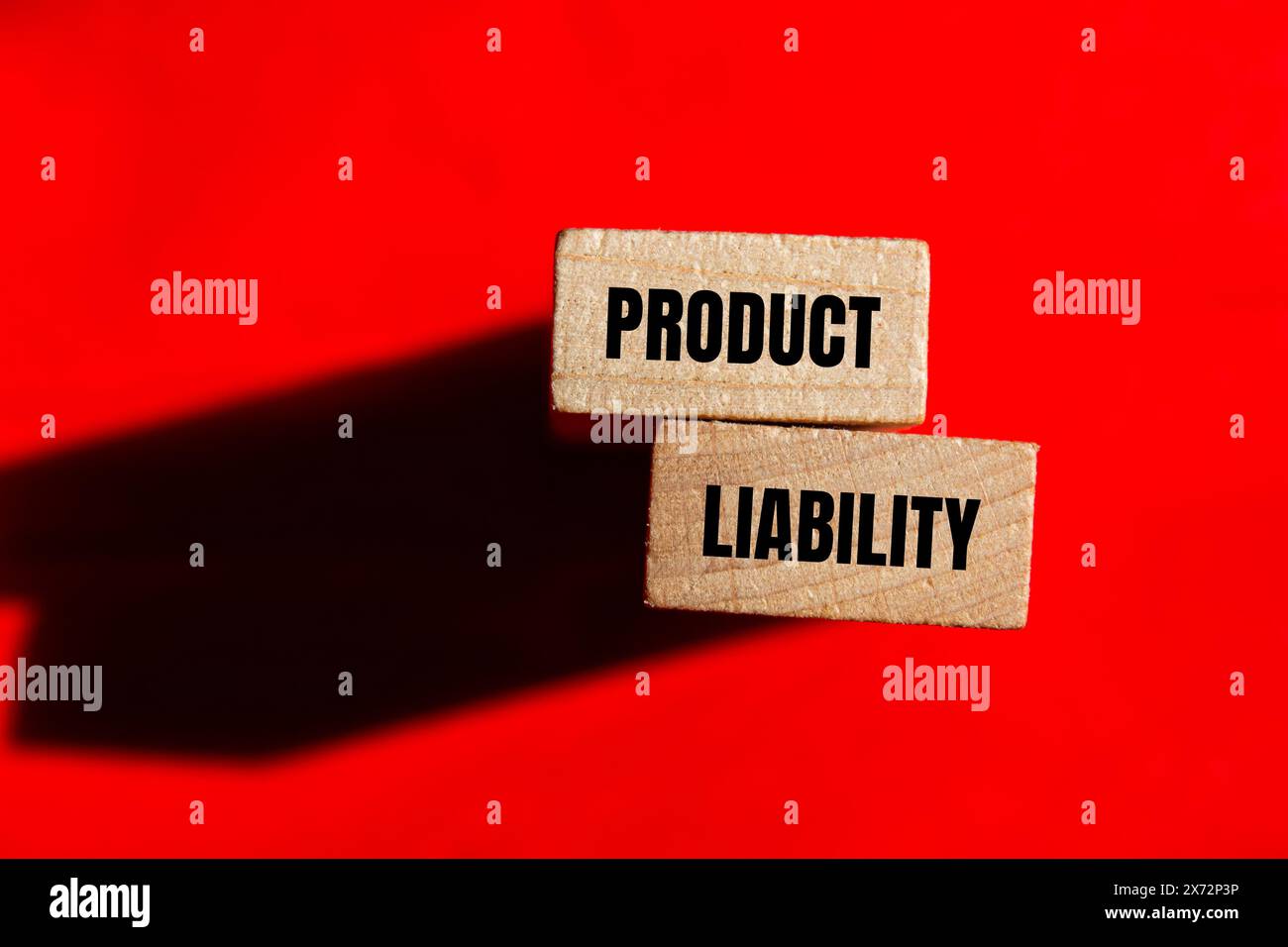 Product liability words written on wooden blocks with red background ...