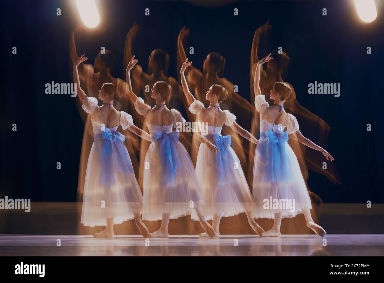 Mesmerizing shot of dancers in motion, their figures creating ghostly ...