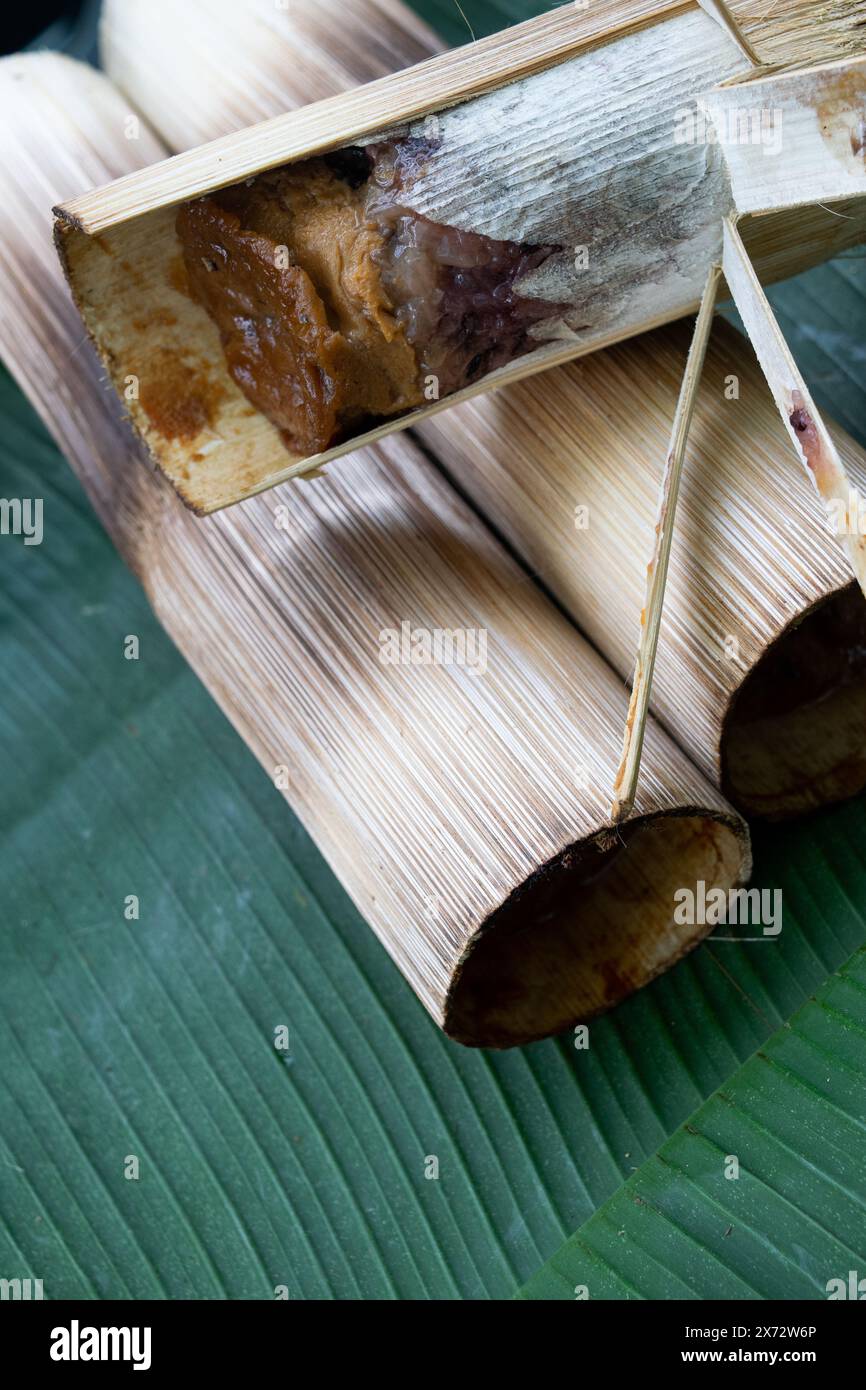 Grilled Bamboo Joint stuffed with Glutinous Rice and Custard on banana ...
