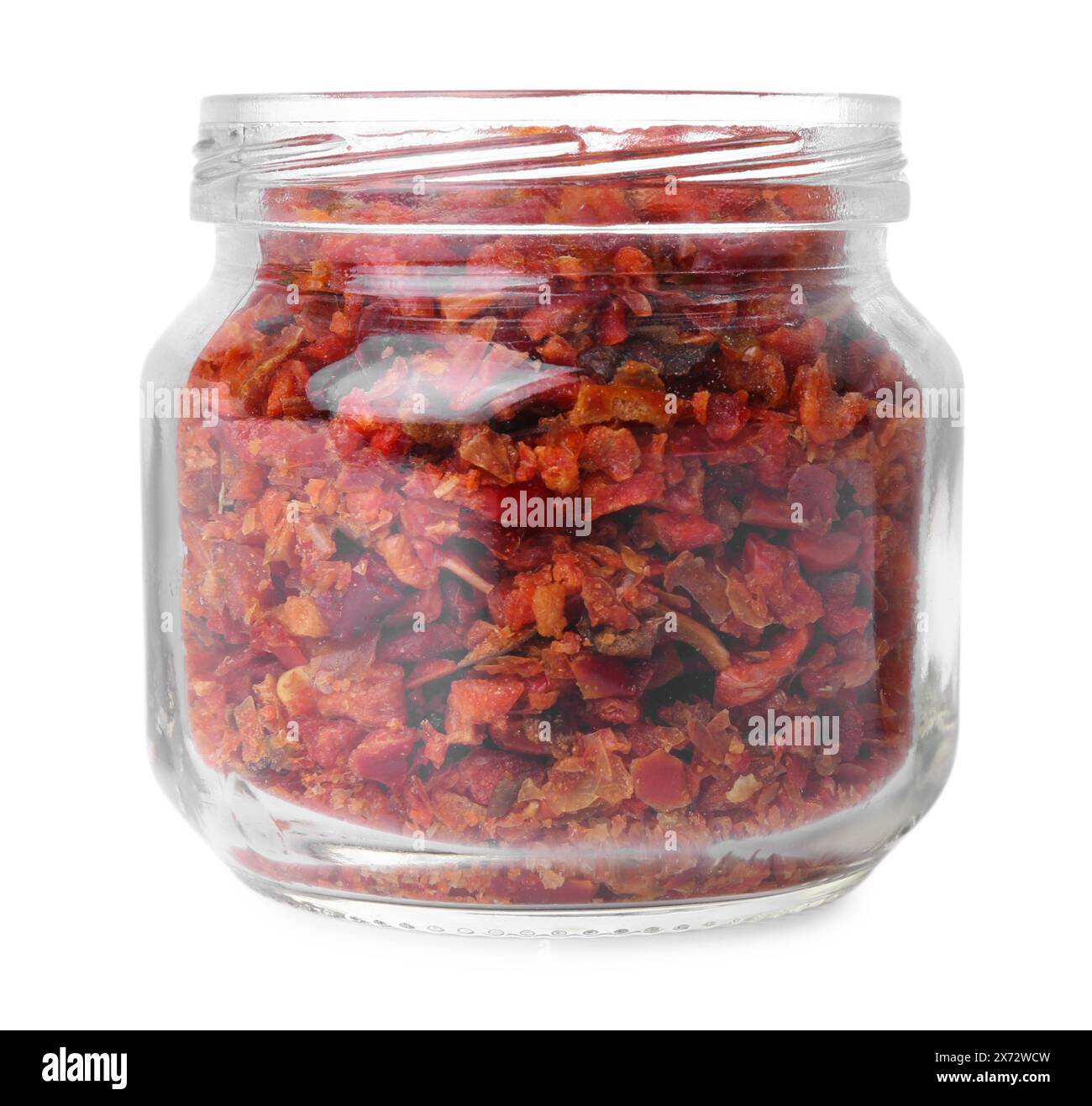 Aromatic spice. Red chili pepper flakes in jar isolated on white Stock ...