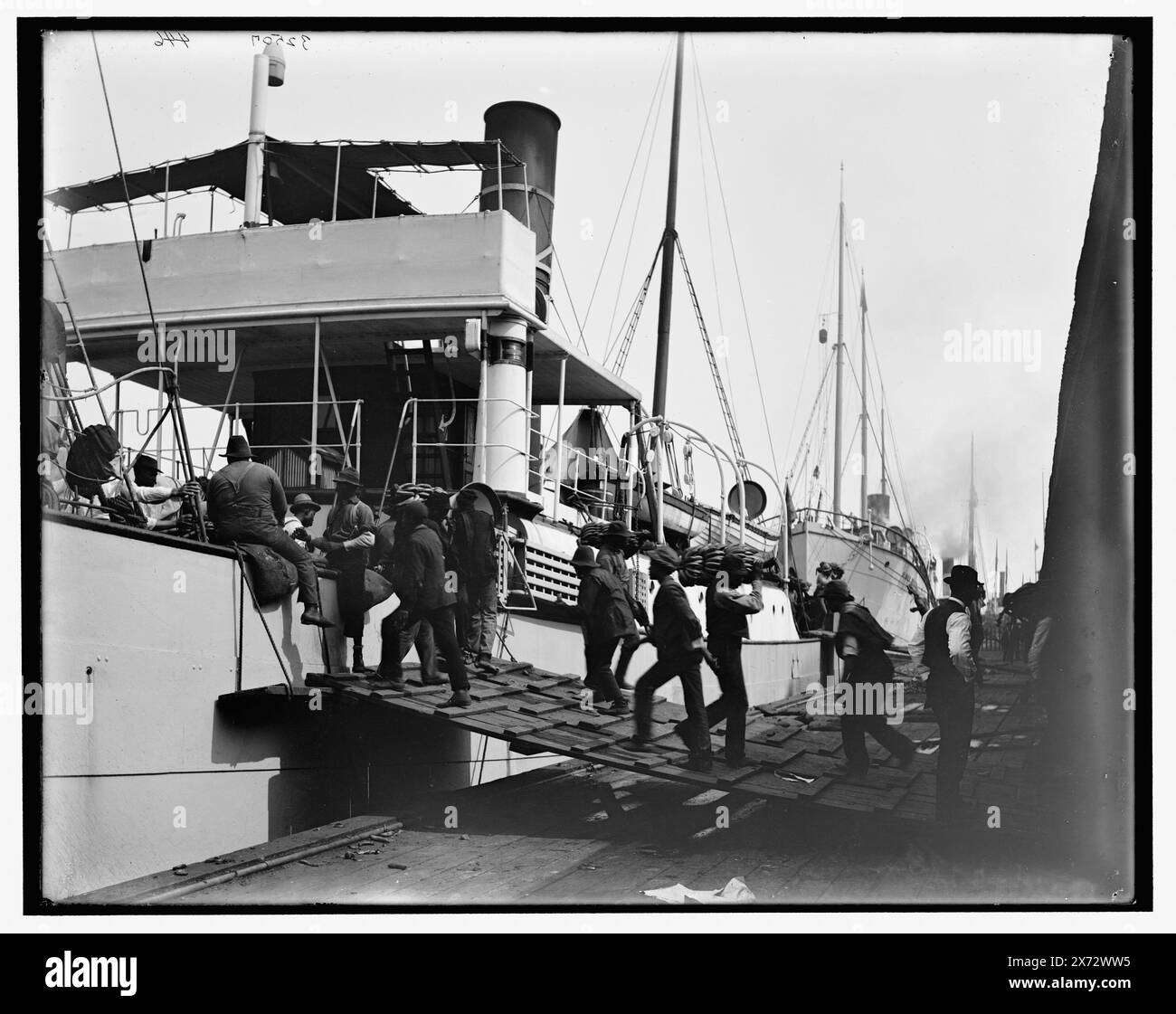 Unloading from ship Cut Out Stock Images & Pictures - Alamy
