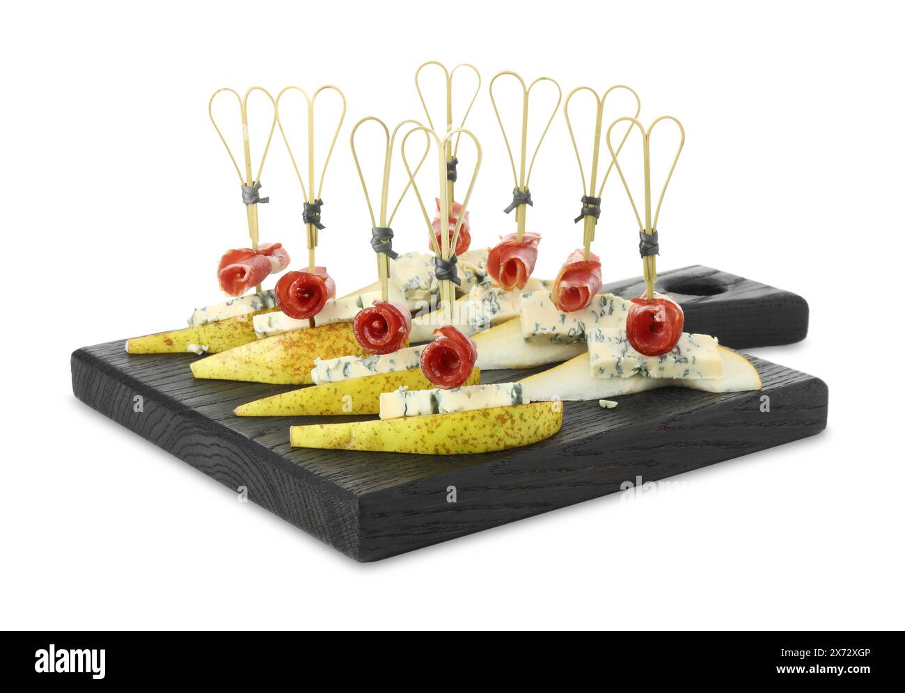 Tasty canapes with pears, blue cheese and prosciutto isolated on white ...