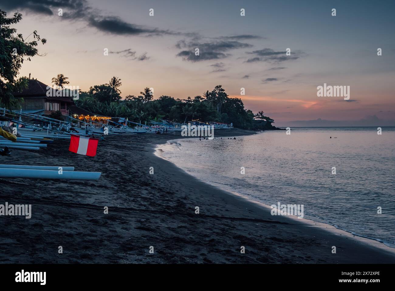 Admiring the sunset from the beach in Amed on Bali island Stock Photo ...