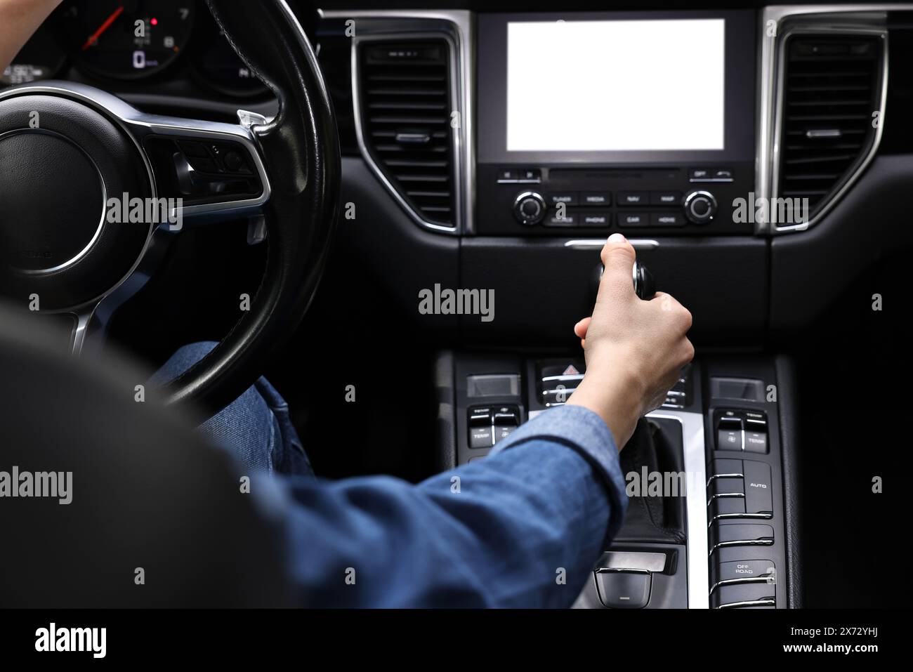 Woman using gear stick while driving her car, closeup Stock Photo - Alamy