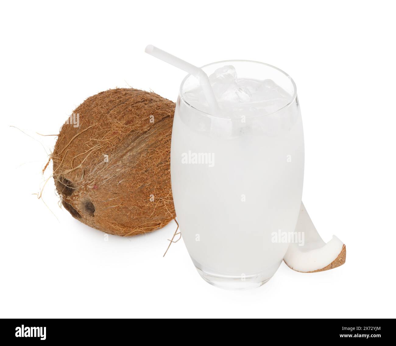Glass of coconut water, ice cubes and nuts isolated on white Stock ...