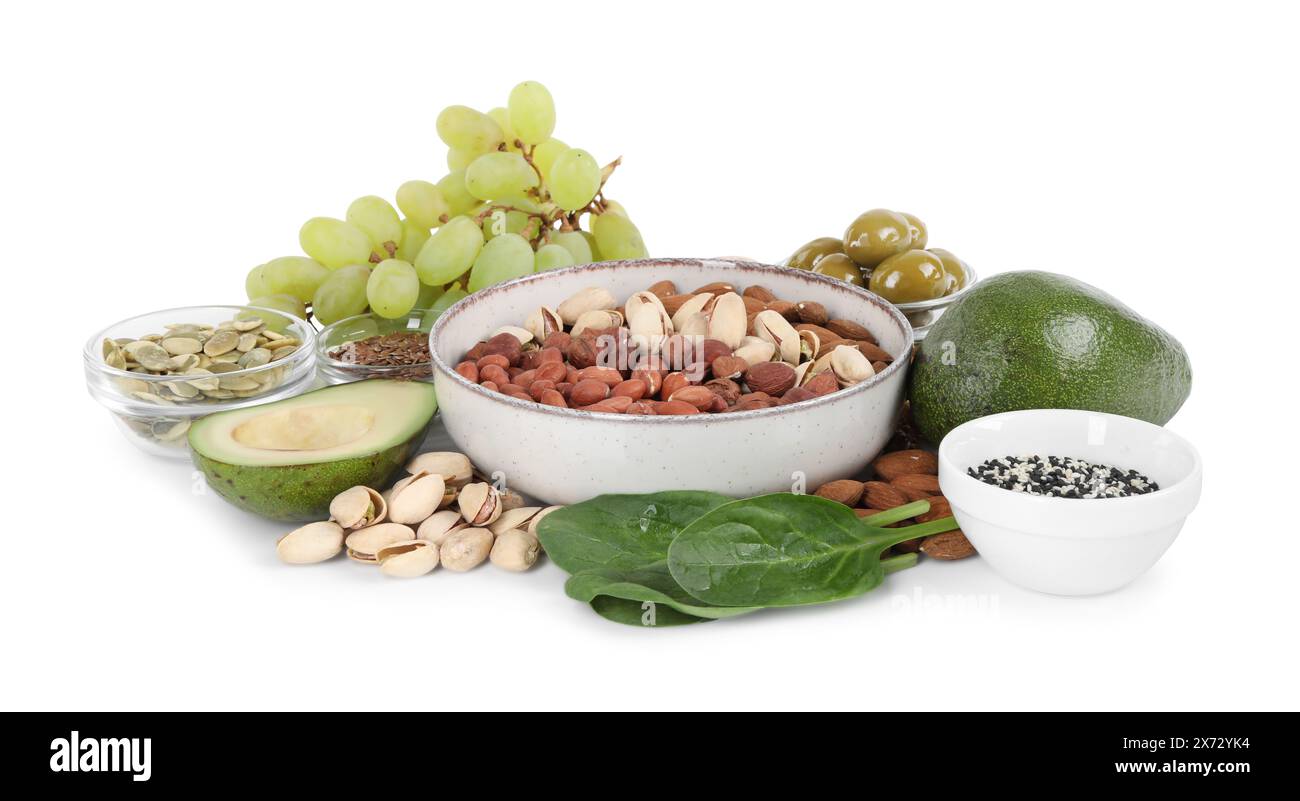 Different nuts, seeds and products high in healthy fats isolated on ...