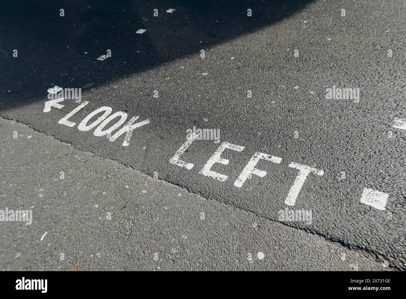 Directions on the road in London where left-hand traffic: "Look left ...