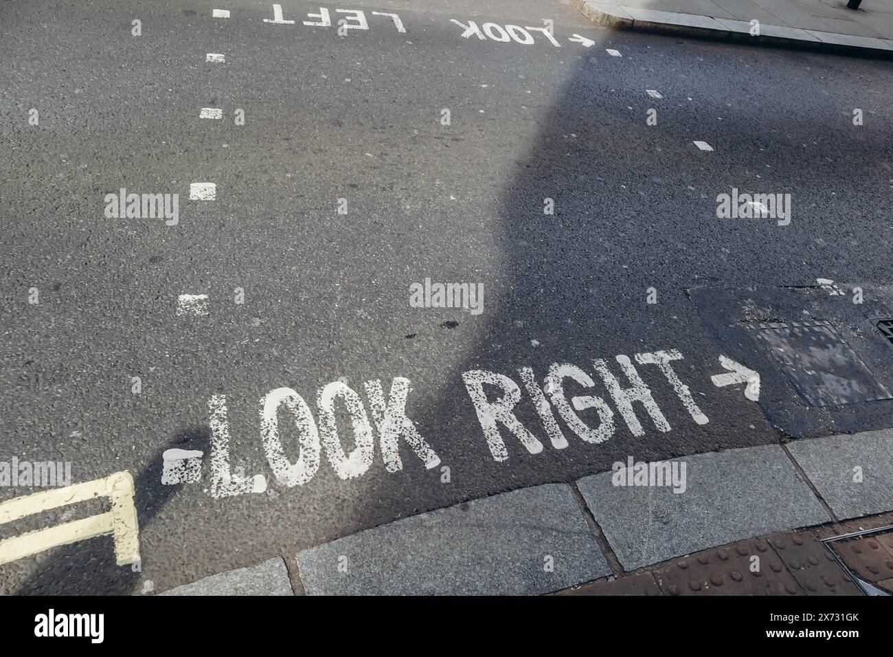 Directions on the road in London where left-hand traffic: "Look left ...