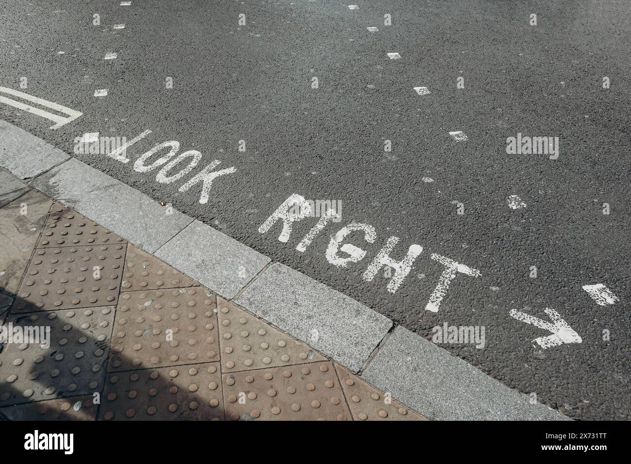 Directions on the road in London where left-hand traffic: "Look left ...