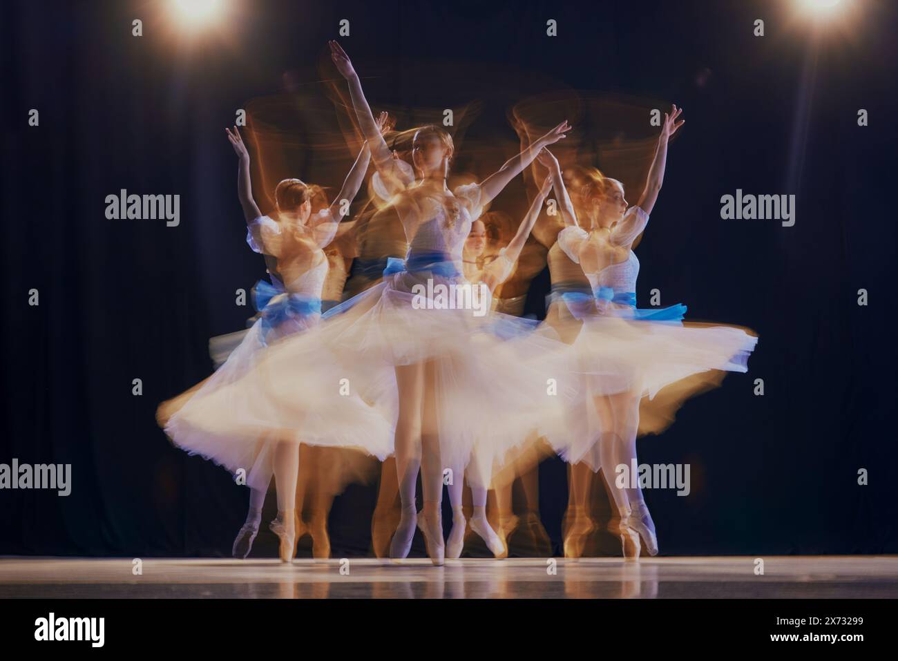 Dancing ballerinas in airy costumes, creating a sense of weightlessness ...