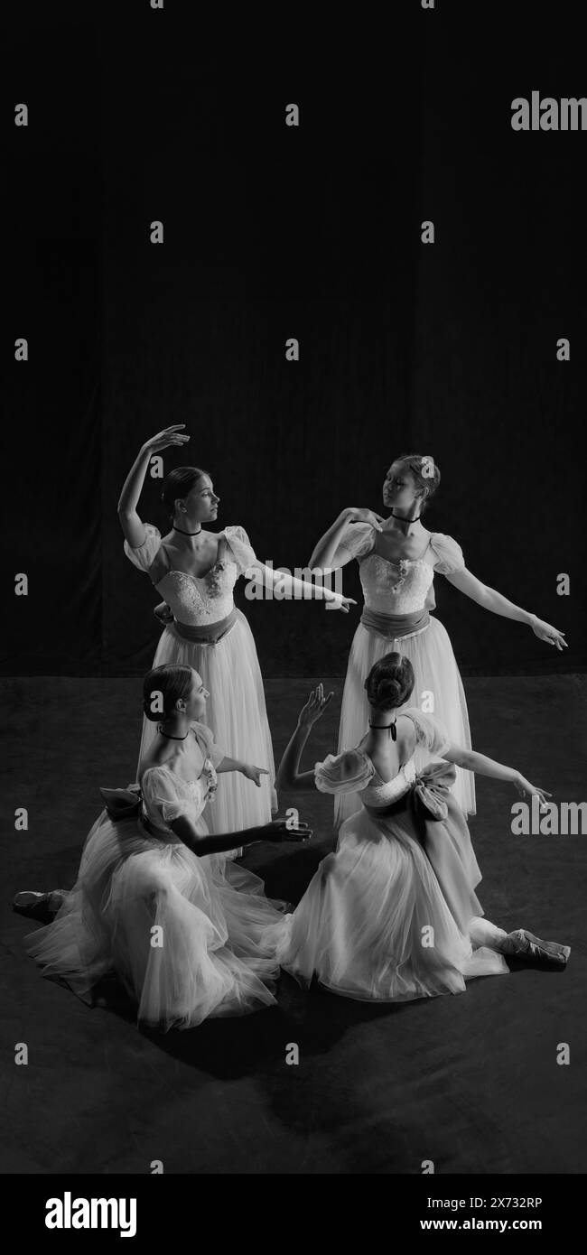 Monochrome portrait of ballerinas in white tutus, showing their dynamics and grace of ballet on ...
