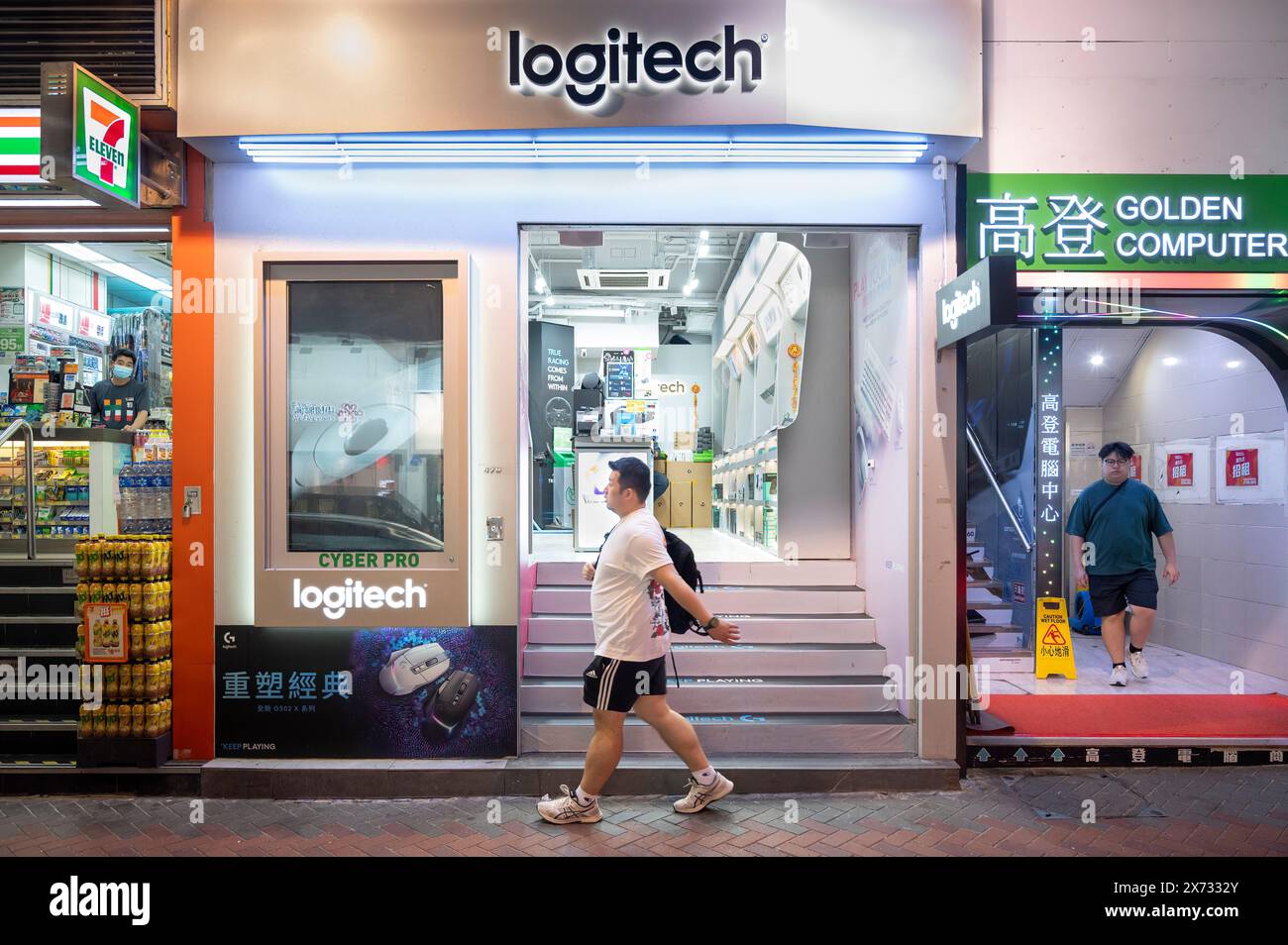 A pedestrian walks past the Swiss electronics company Logitech store in ...