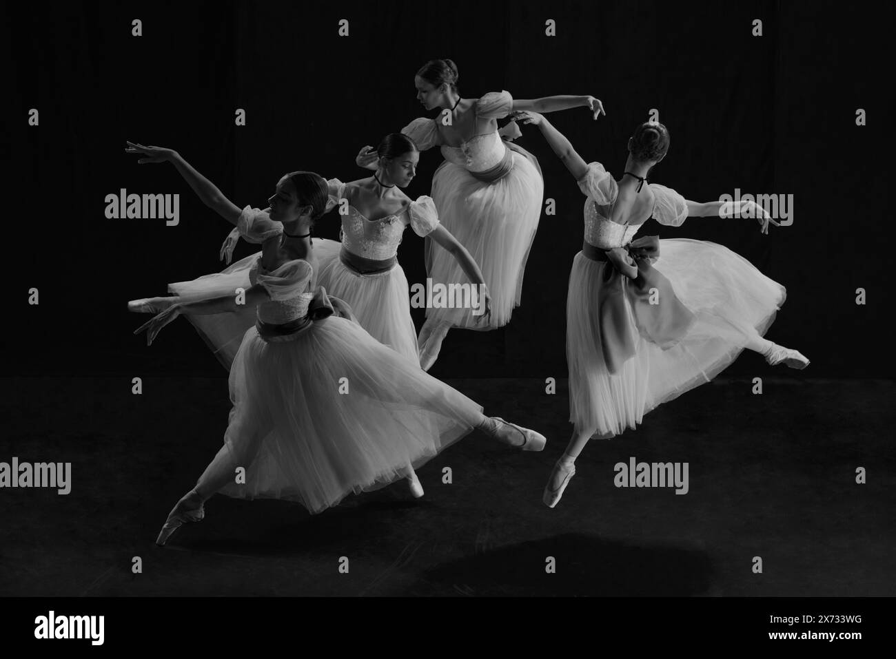 Black and white photo of young female ballet dancers in synchronized ...