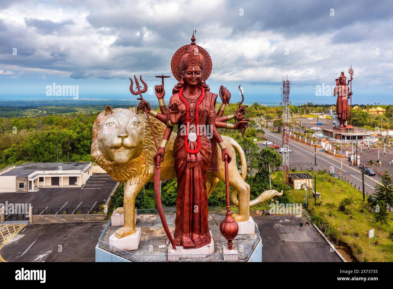 A powerful Statue of the Hindu goddess Durga Maa with a golden lion in ...