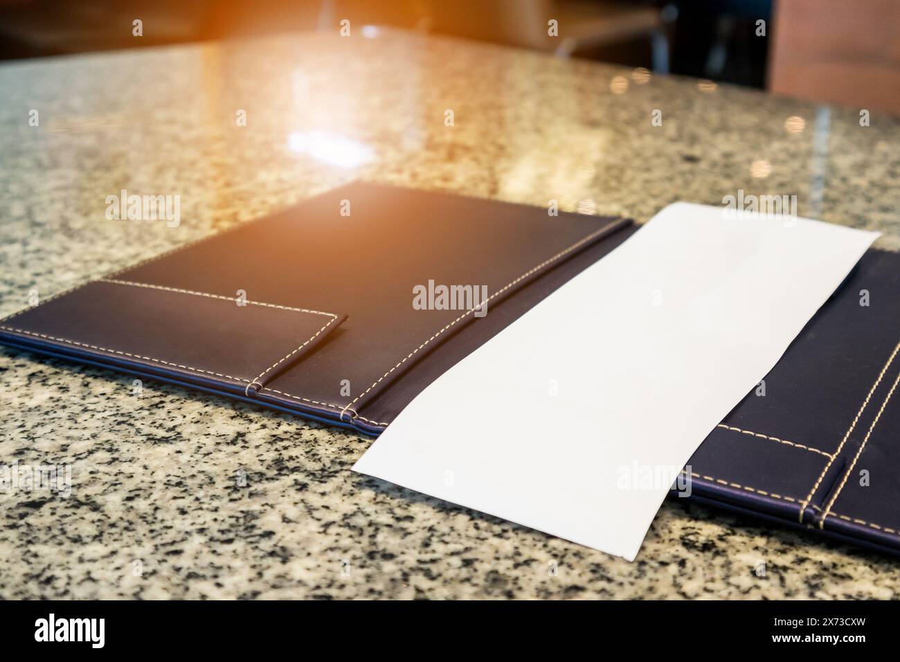 Blank empty white paper in restaurant payment billing receipt folder on ...