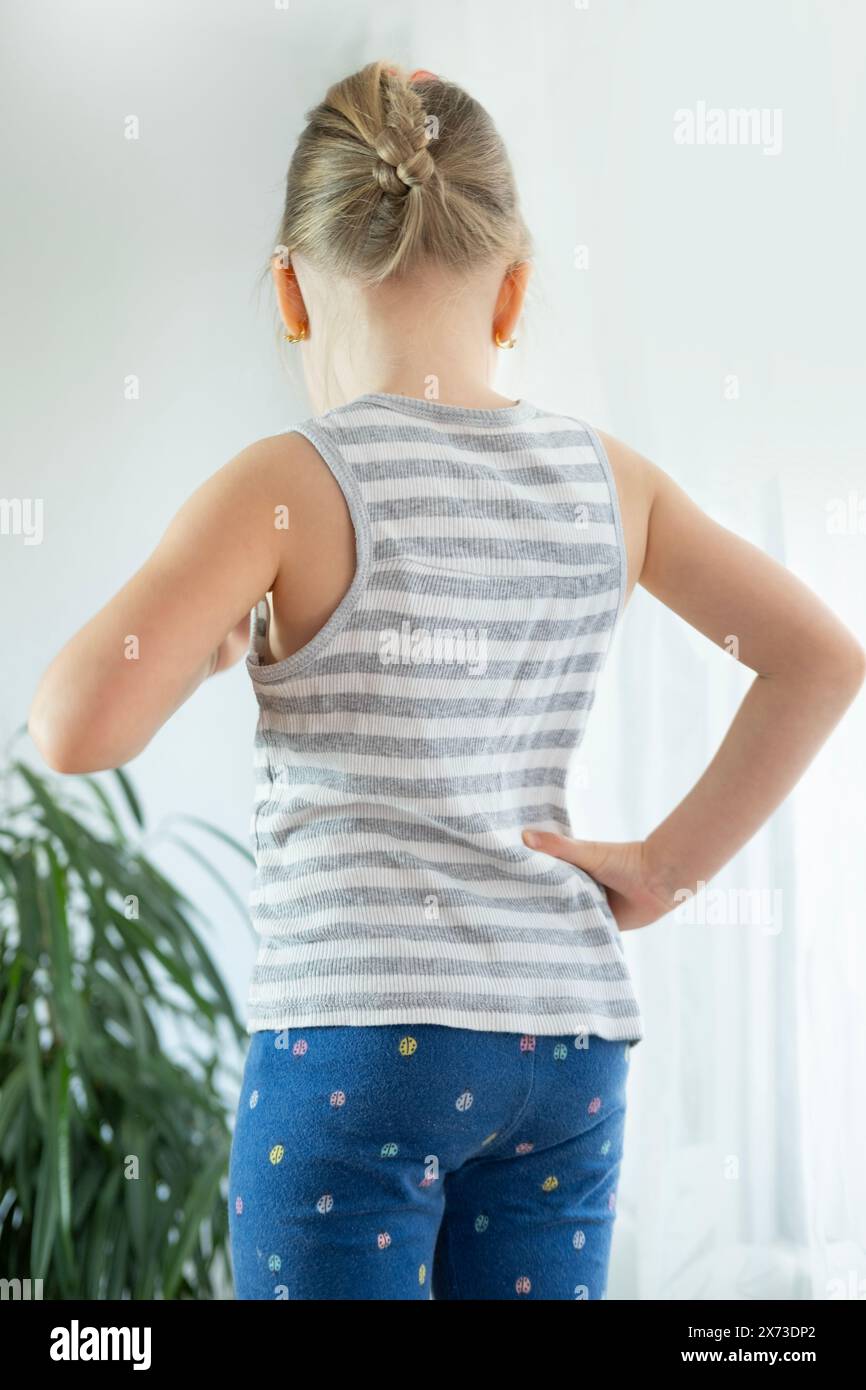 five-year-old child, young girl stands with back straight, showcasing ...