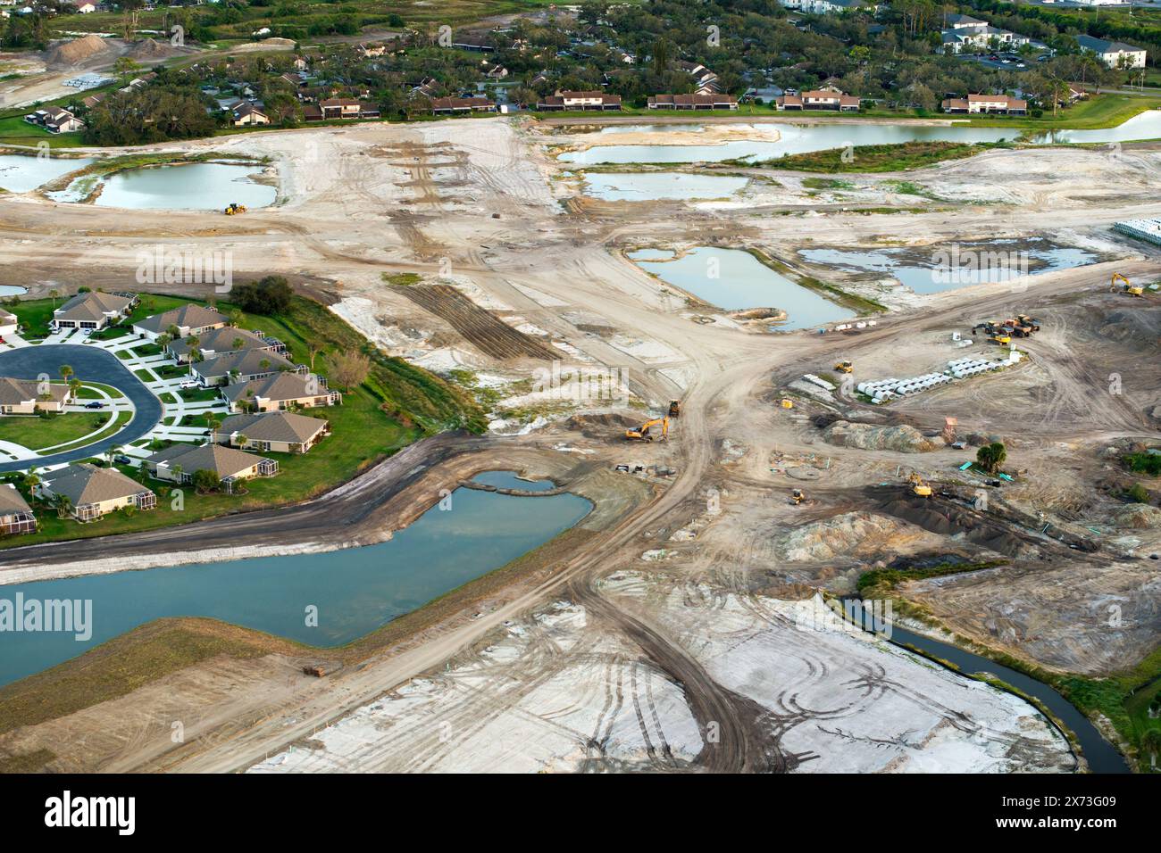 Construction site with building equipment on prepared ground in ...