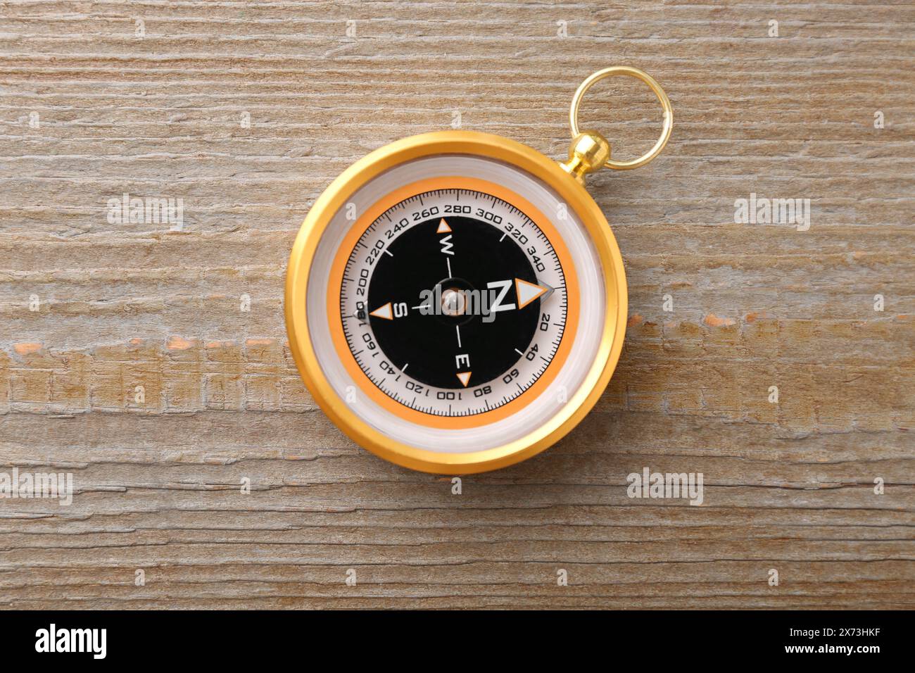 One compass on wooden hi-res stock photography and images - Alamy