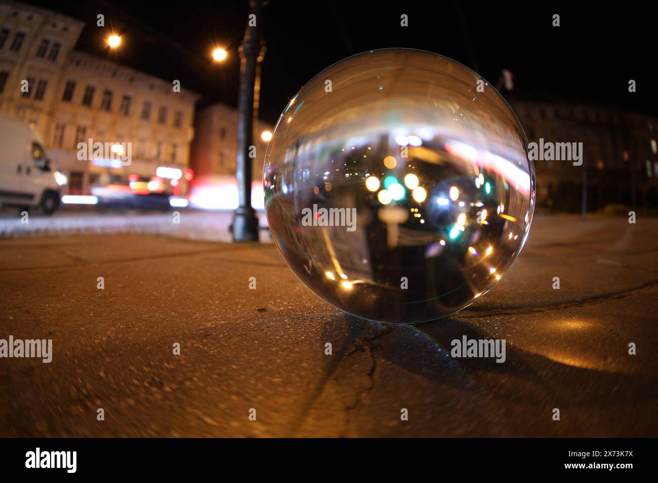 Crystal ball on asphalt road at night. Wide-angle lens Stock Photo - Alamy