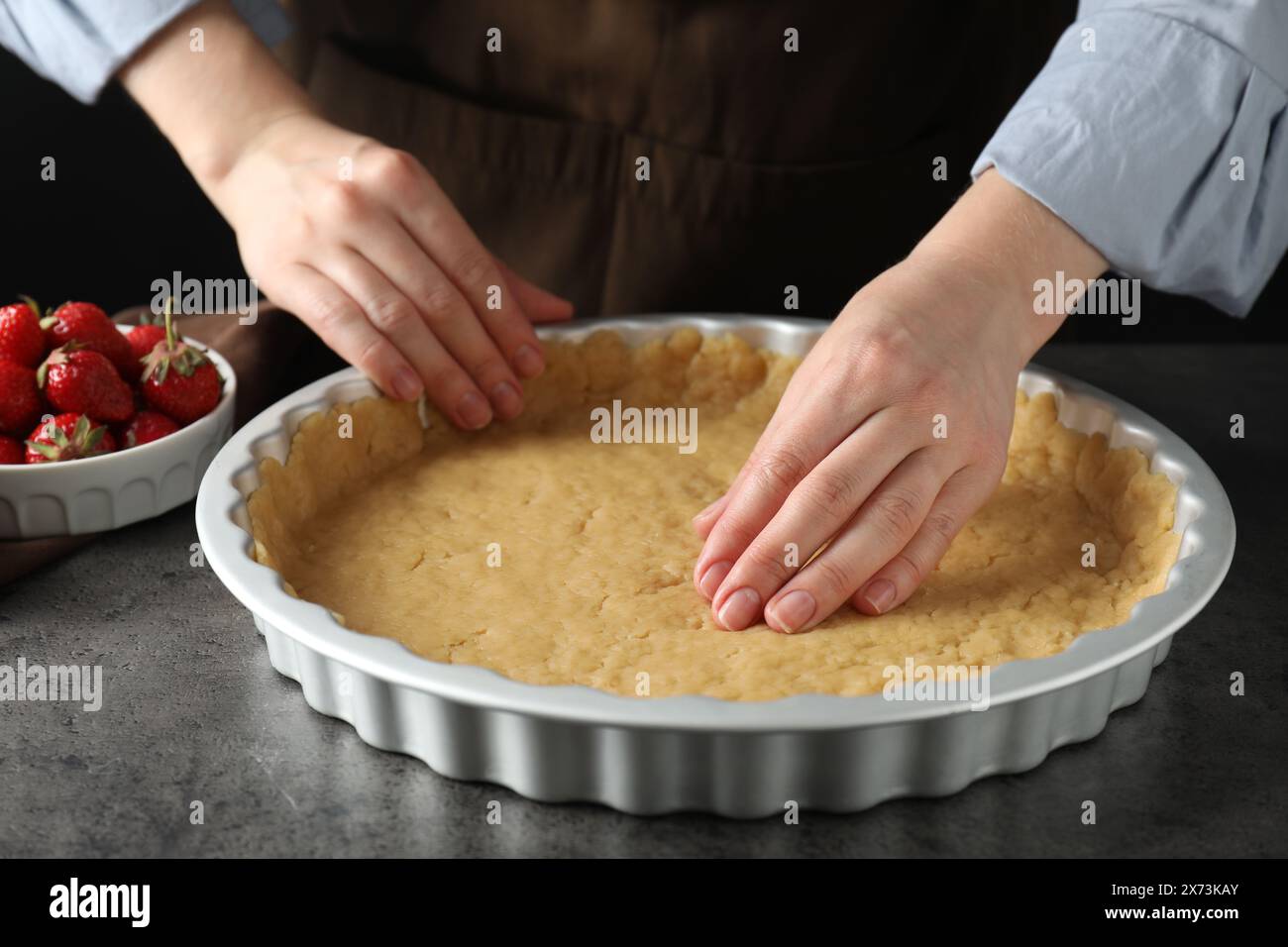 Shortcrust pastry. Woman making pie at grey table, closeup Stock Photo ...