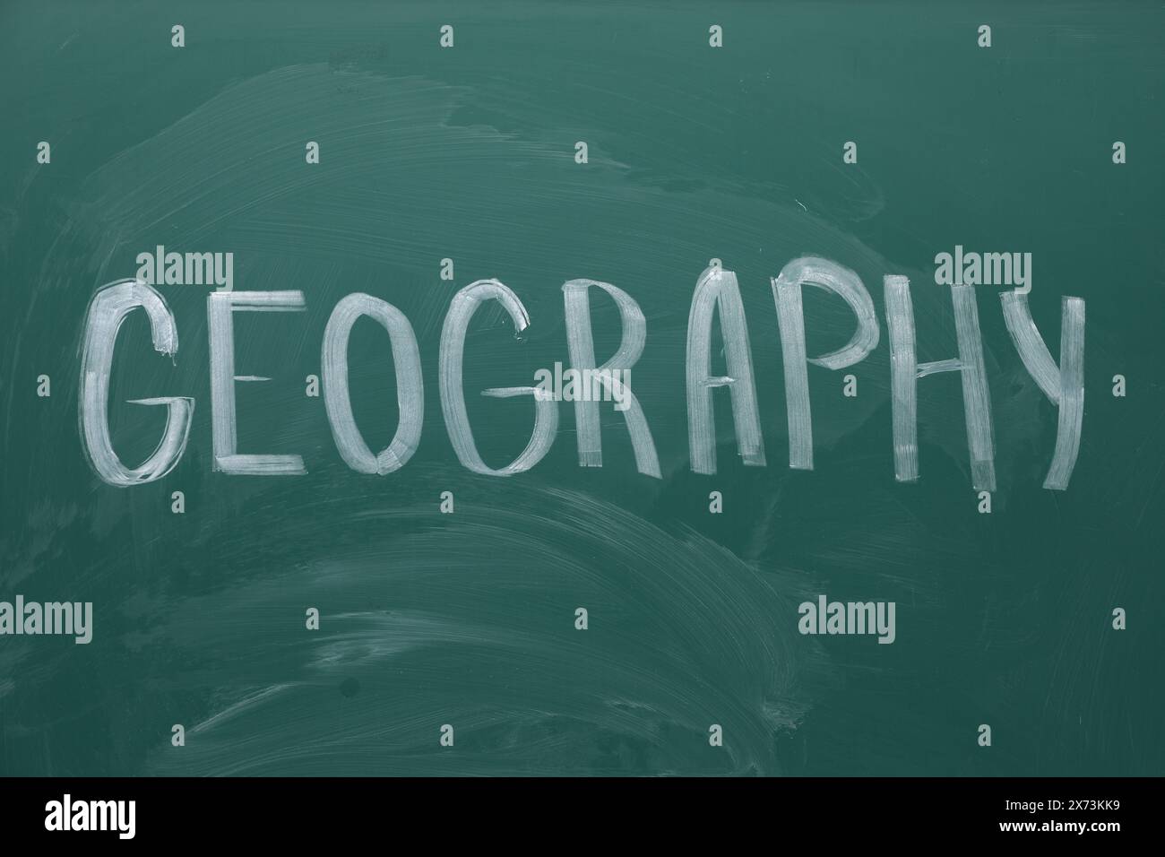 Word Geography written with chalk on green board Stock Photo - Alamy