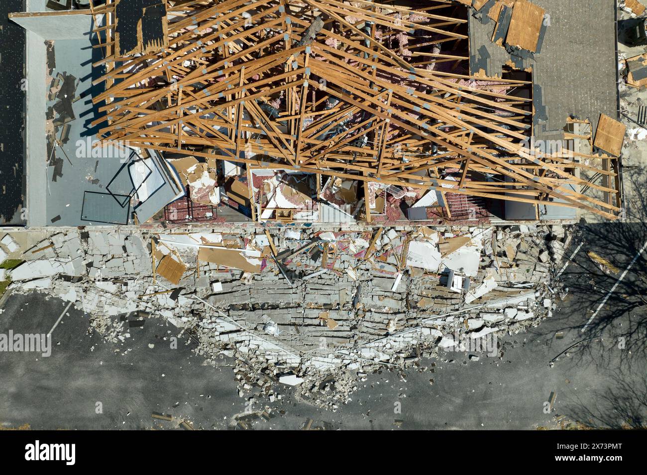 Ruined building in need of repair. Wind damaged house roof with missing ...