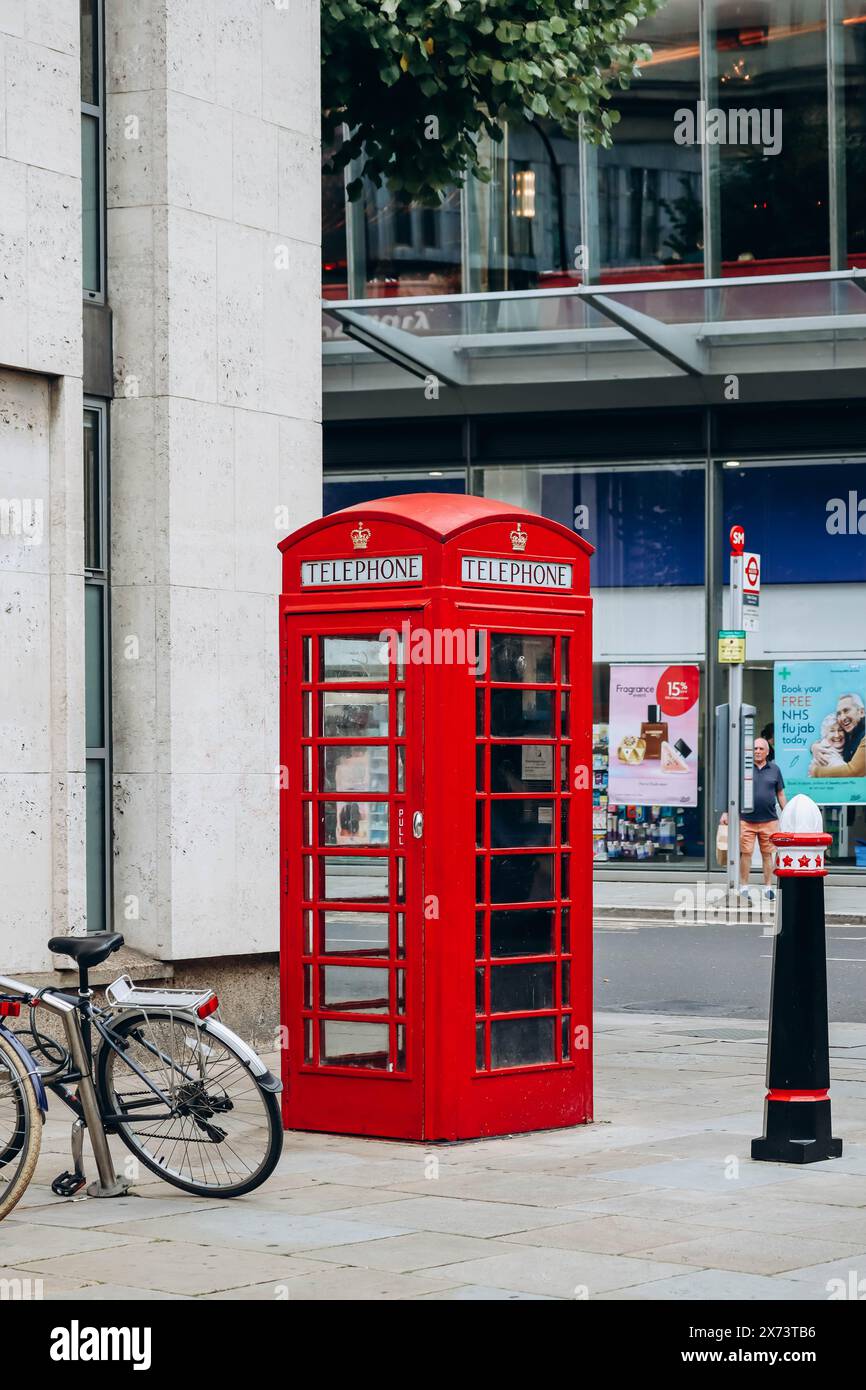 Iconic red telephone boxes in central London Stock Photo - Alamy