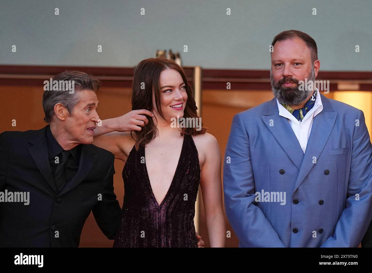 Willem Dafoe, from left, Emma Stone, and director Yorgos Lanthimos pose for photographers upon ...