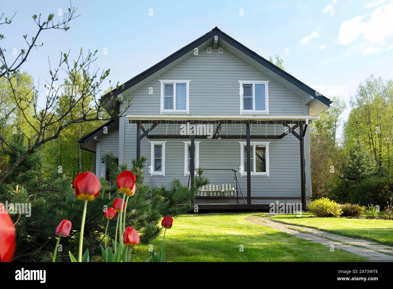 Cottagecore contemporary two-story house of timber in countryside in ...