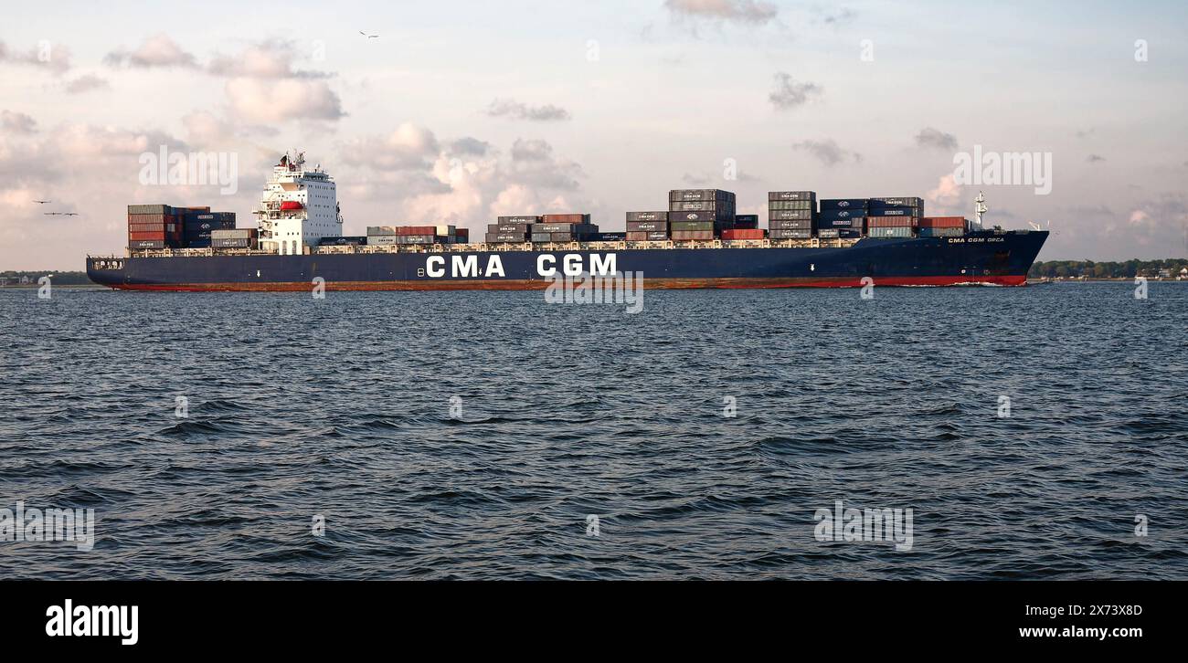 large cargo ship underway; cargo containers; bulk carrier, work boat ...