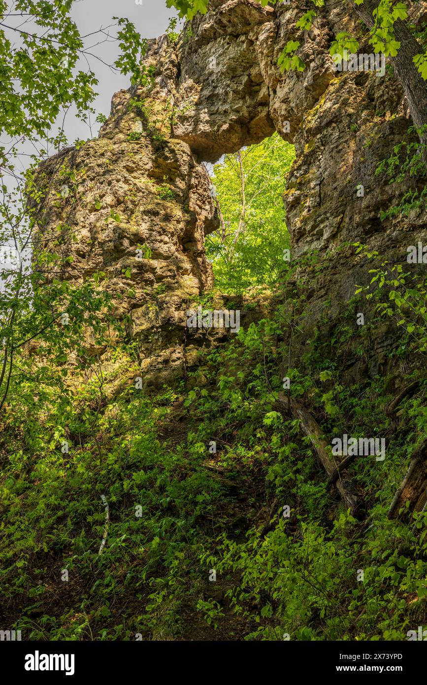 A stone arch formation in the woods during spring Stock Photo - Alamy