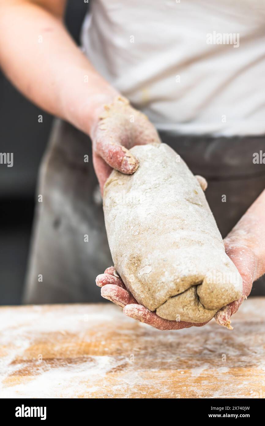 Baker shows prepared bread hi-res stock photography and images - Alamy