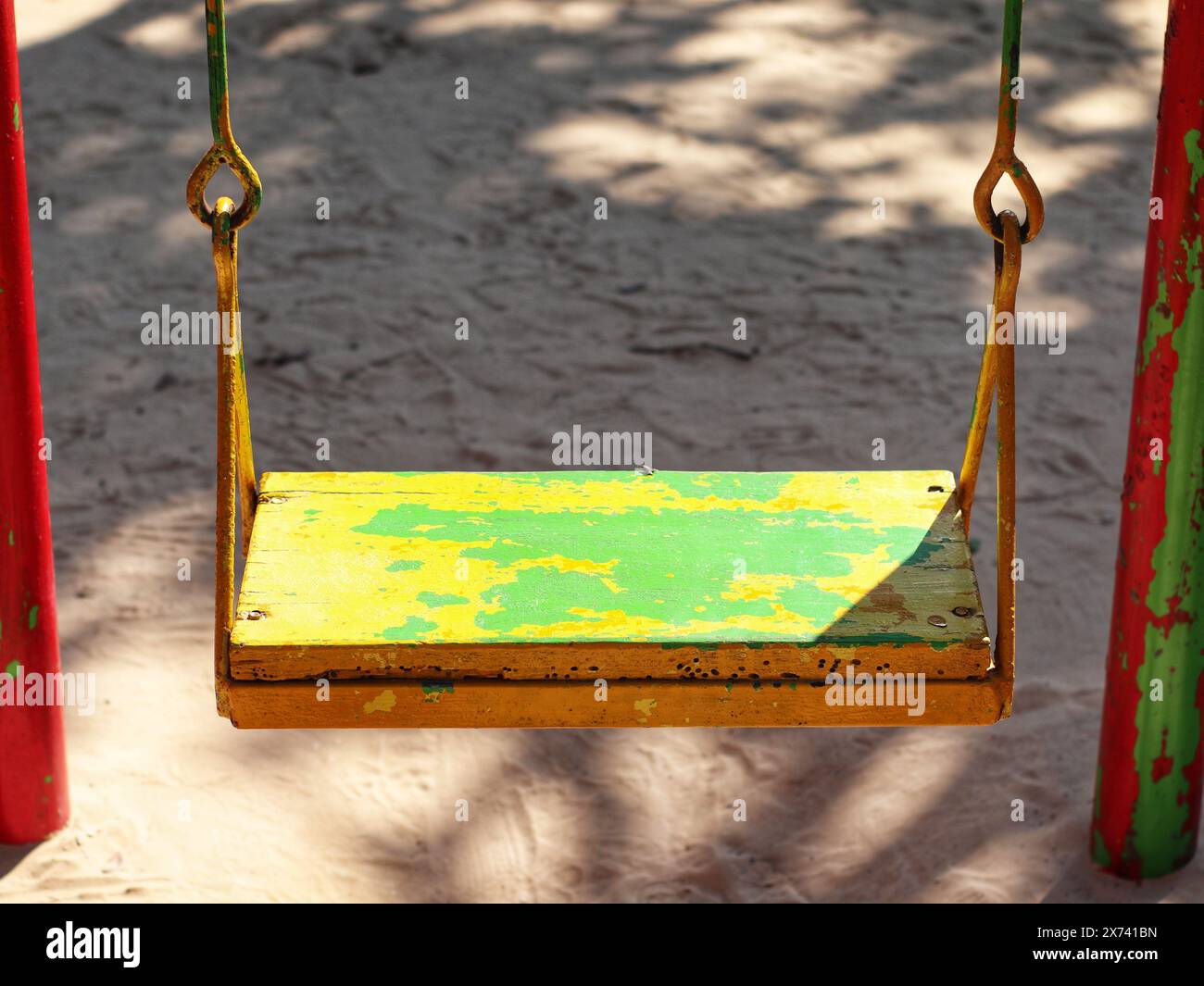 empty iron swing in the playground Stock Photo - Alamy