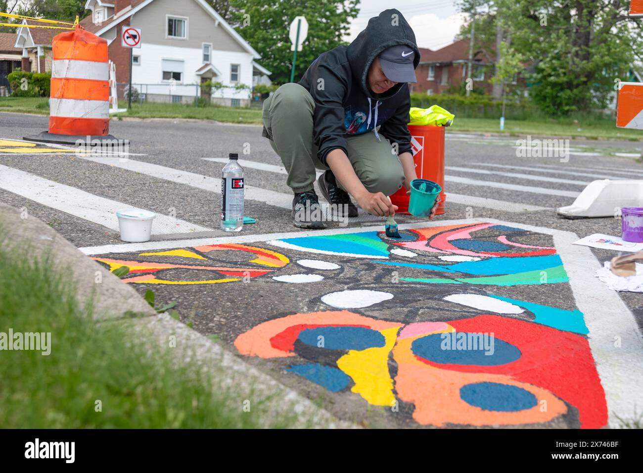 Detroit, Michigan - Artist Simone Lancaster paints a design on a city ...