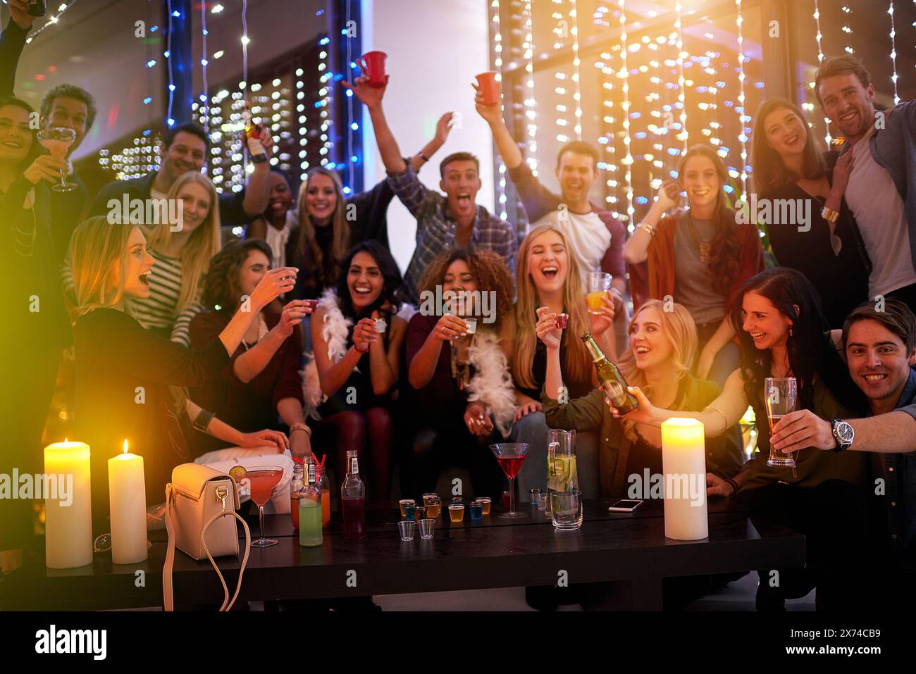 Drinks, portrait and group of people in nightclub for fun, happy ...