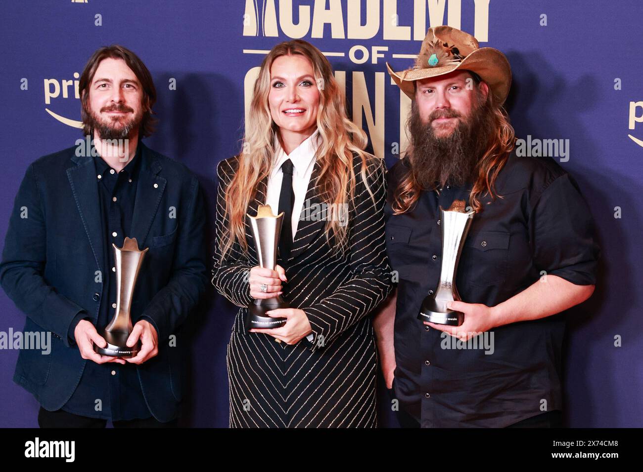Frisco, USA. 17th May, 2024. Dave Cobb, Morgane Stapleton, and Chris Stapleton, winners of the ...
