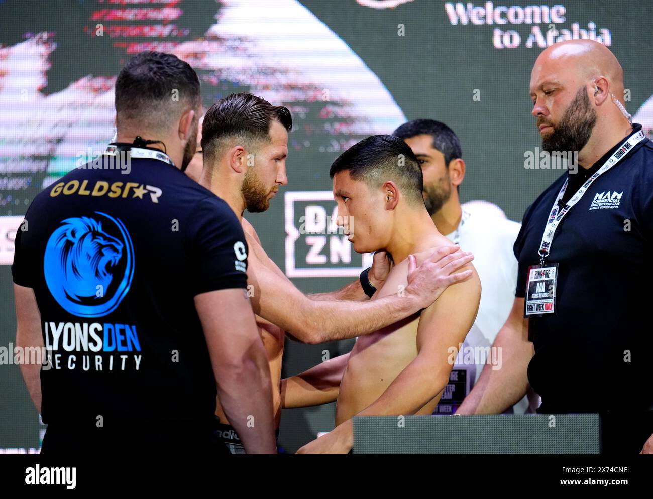 Isaac Lowe pushes Hasibullah Ahmadi as they face off during a weigh-in ...