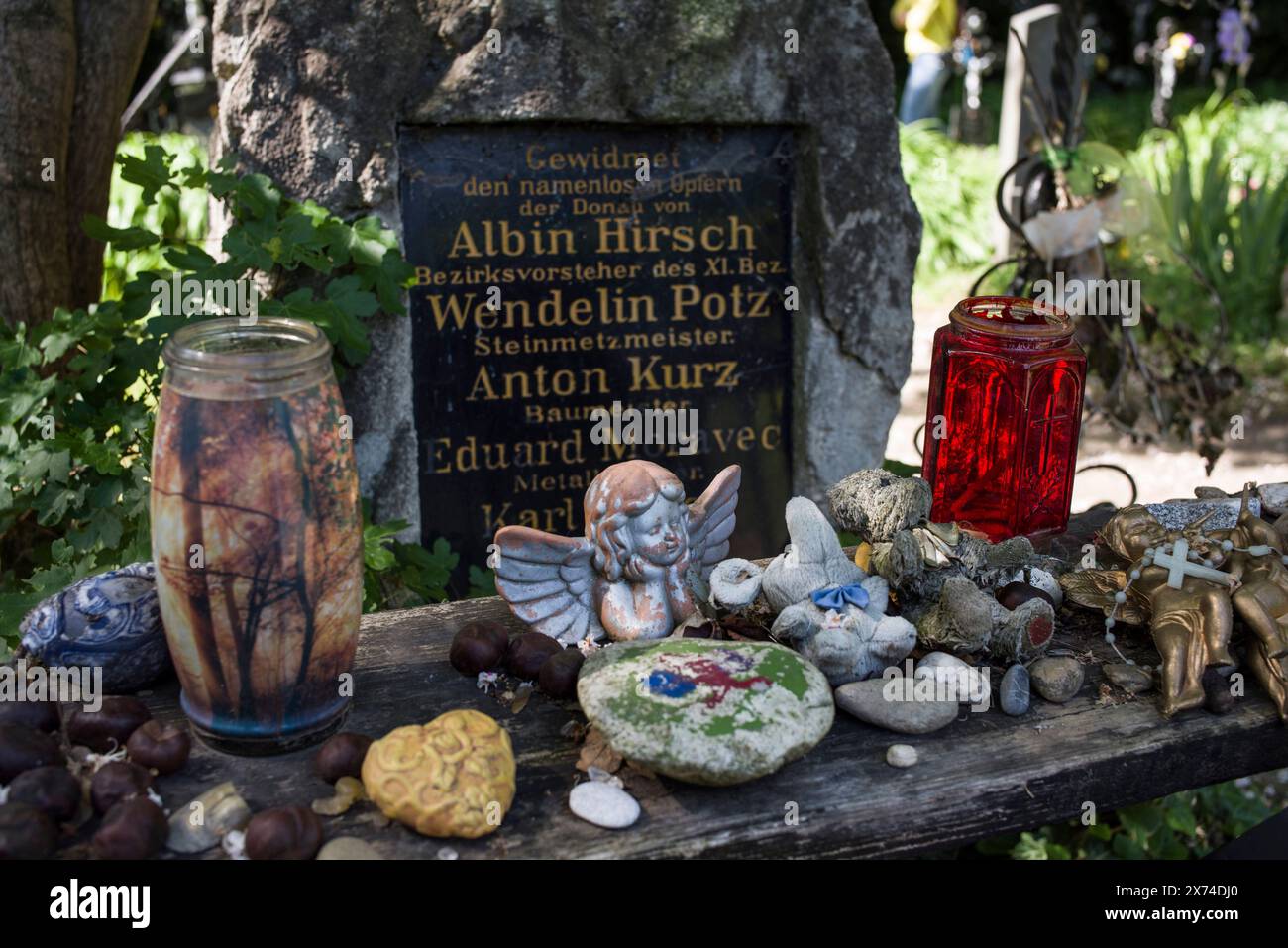 The words on a stone reads the names of people who created the cemetery ...
