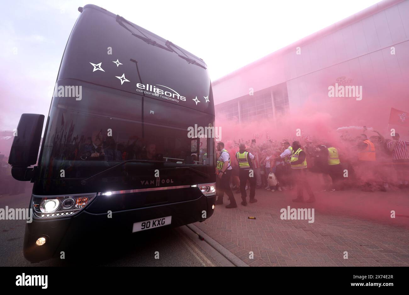 Southampton fans set off flares outside the stadium as the team bus ...