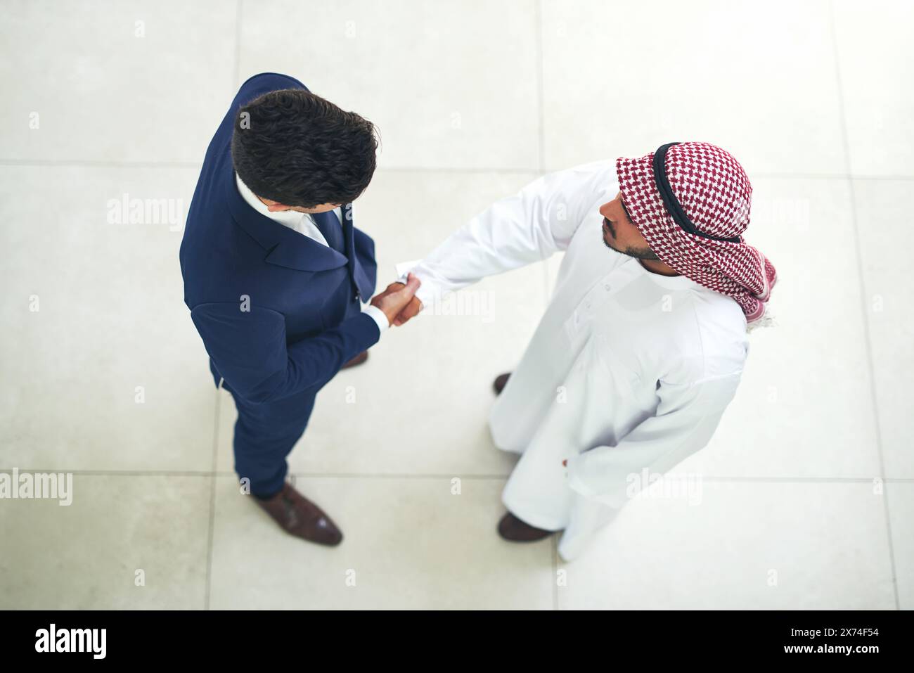 Arab, business and people with handshake in workplace, recruitment and ...