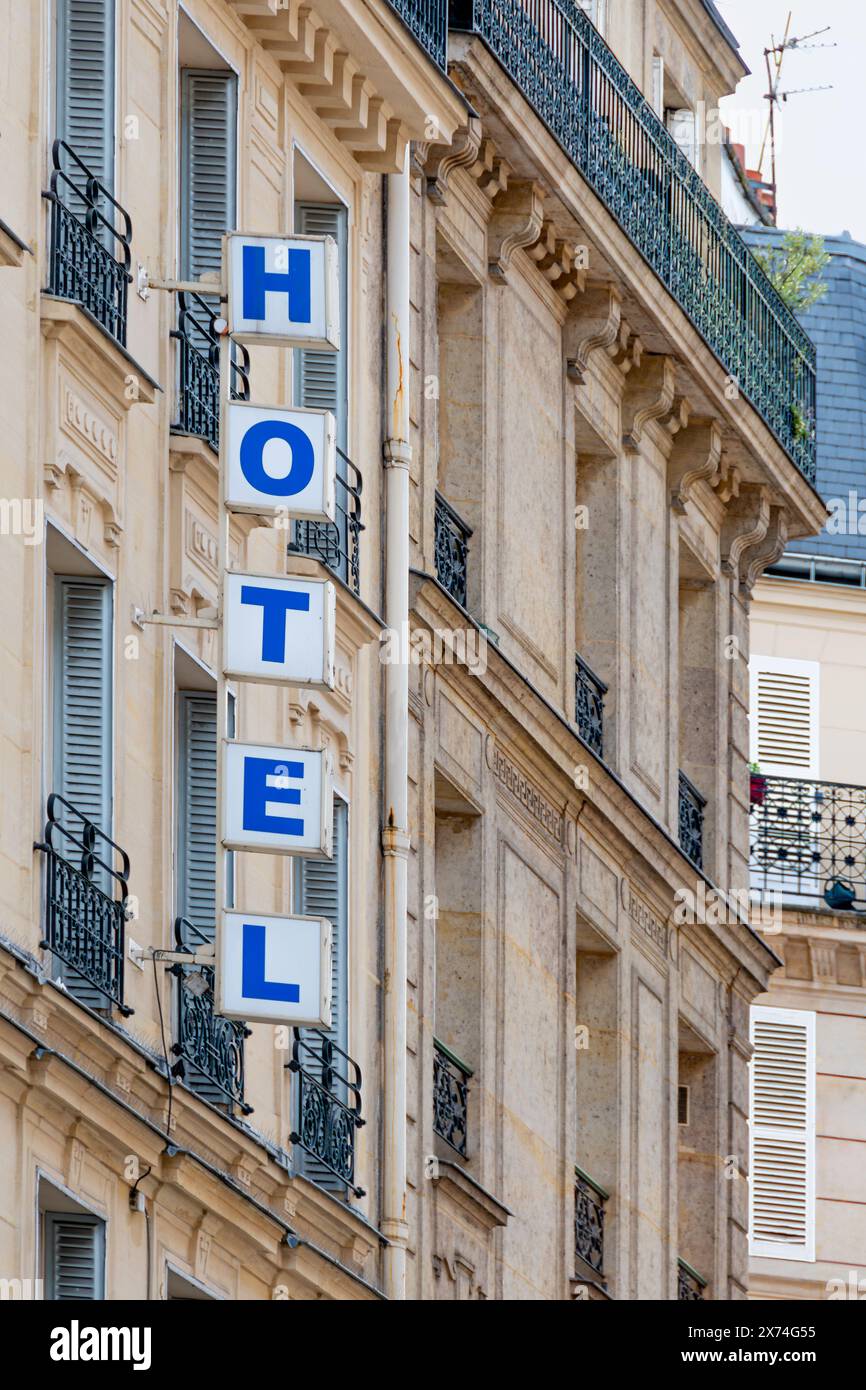 Sign with the word 'HOTEL' written in bright capital letters on the ...