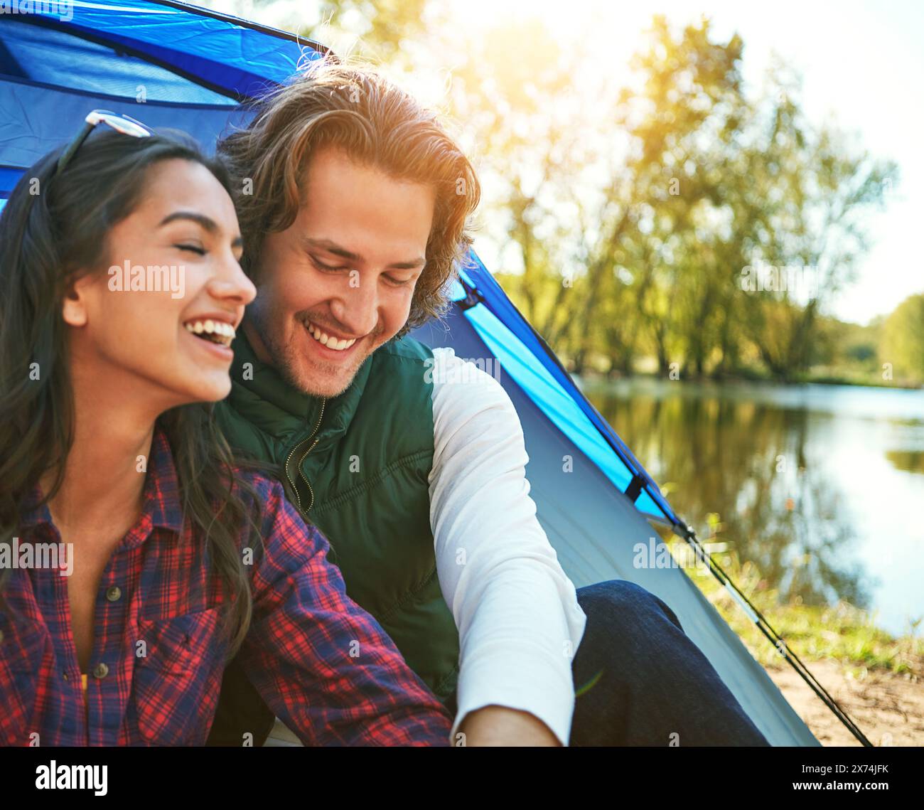 Couple laugh tent river hi-res stock photography and images - Alamy